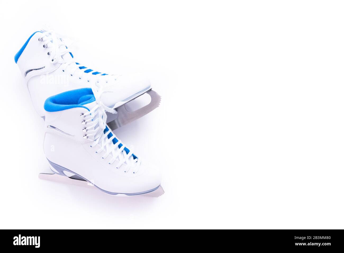 Flat lay. New white figure skates on a white background Stock Photo - Alamy
