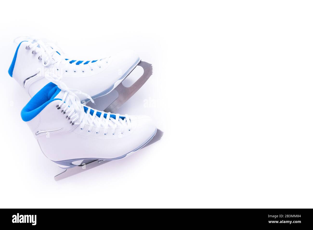 Flat lay. New white figure skates on a white background Stock Photo - Alamy