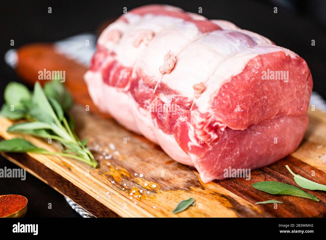 Uncooked boneless pork roast on the cutting board Stock Photo - Alamy