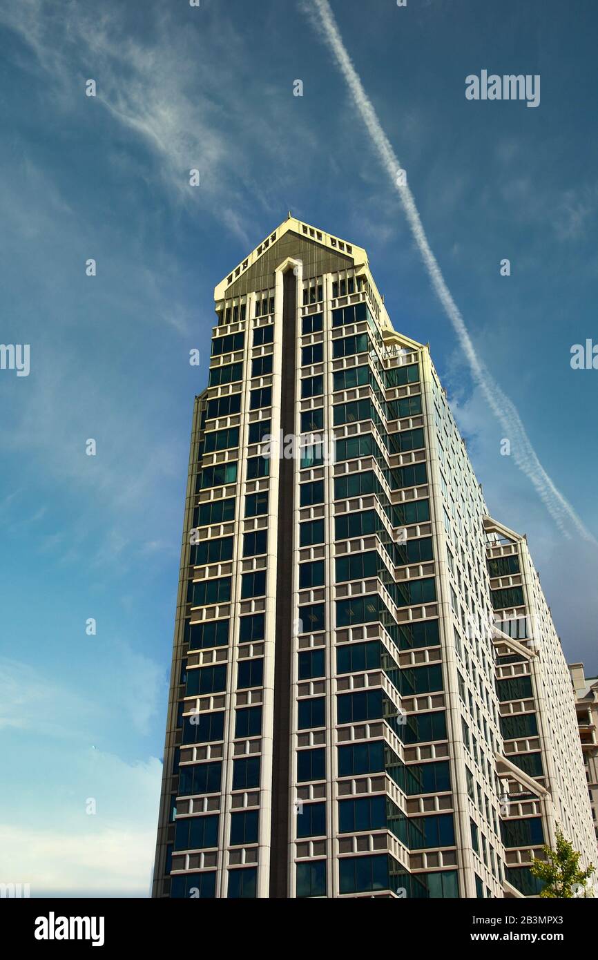 Modern Condo Tower Under Pleasant Skies Stock Photo - Alamy