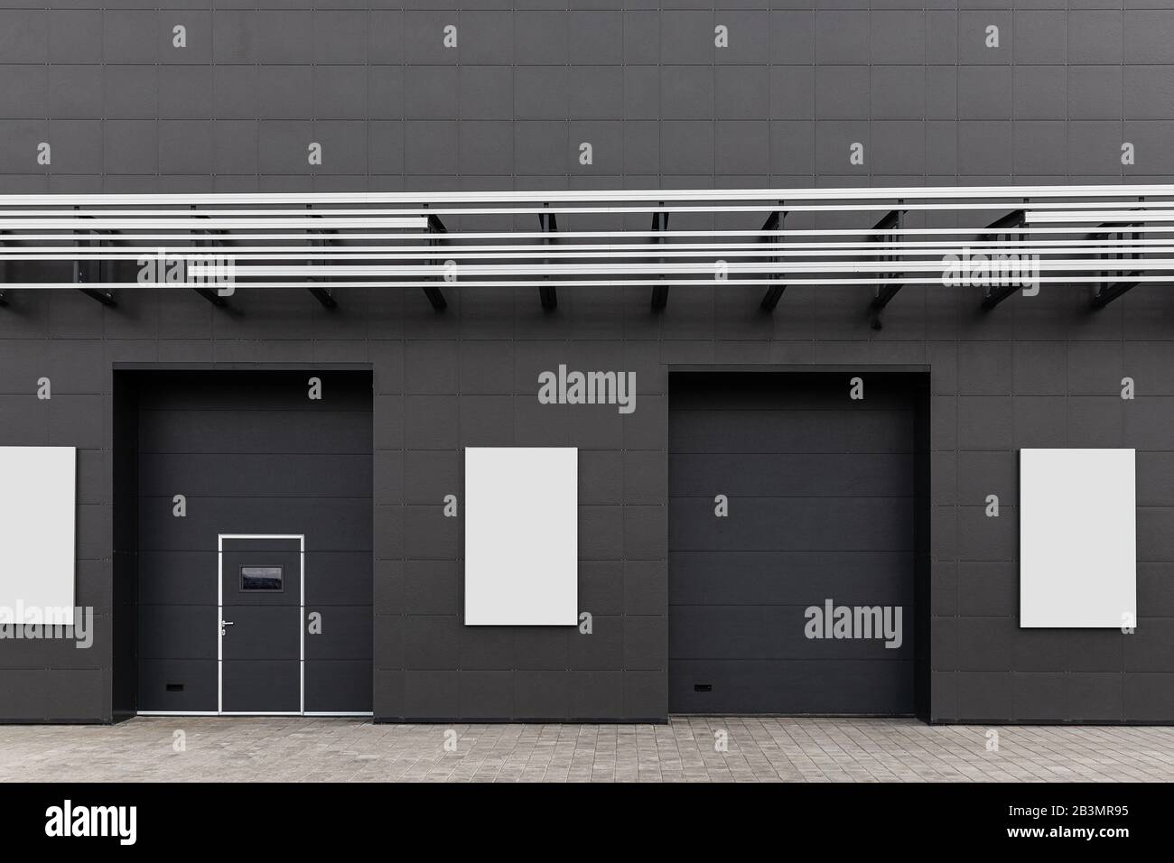 Black wall of the building with doors, emergency exits Stock Photo - Alamy