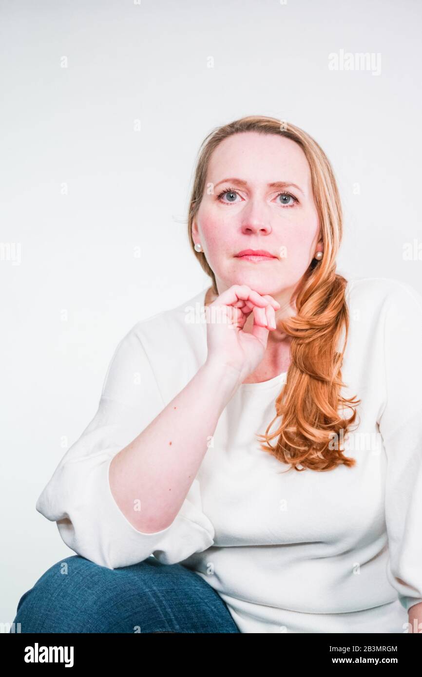 Studio portrait of middle aged business woman Stock Photo - Alamy