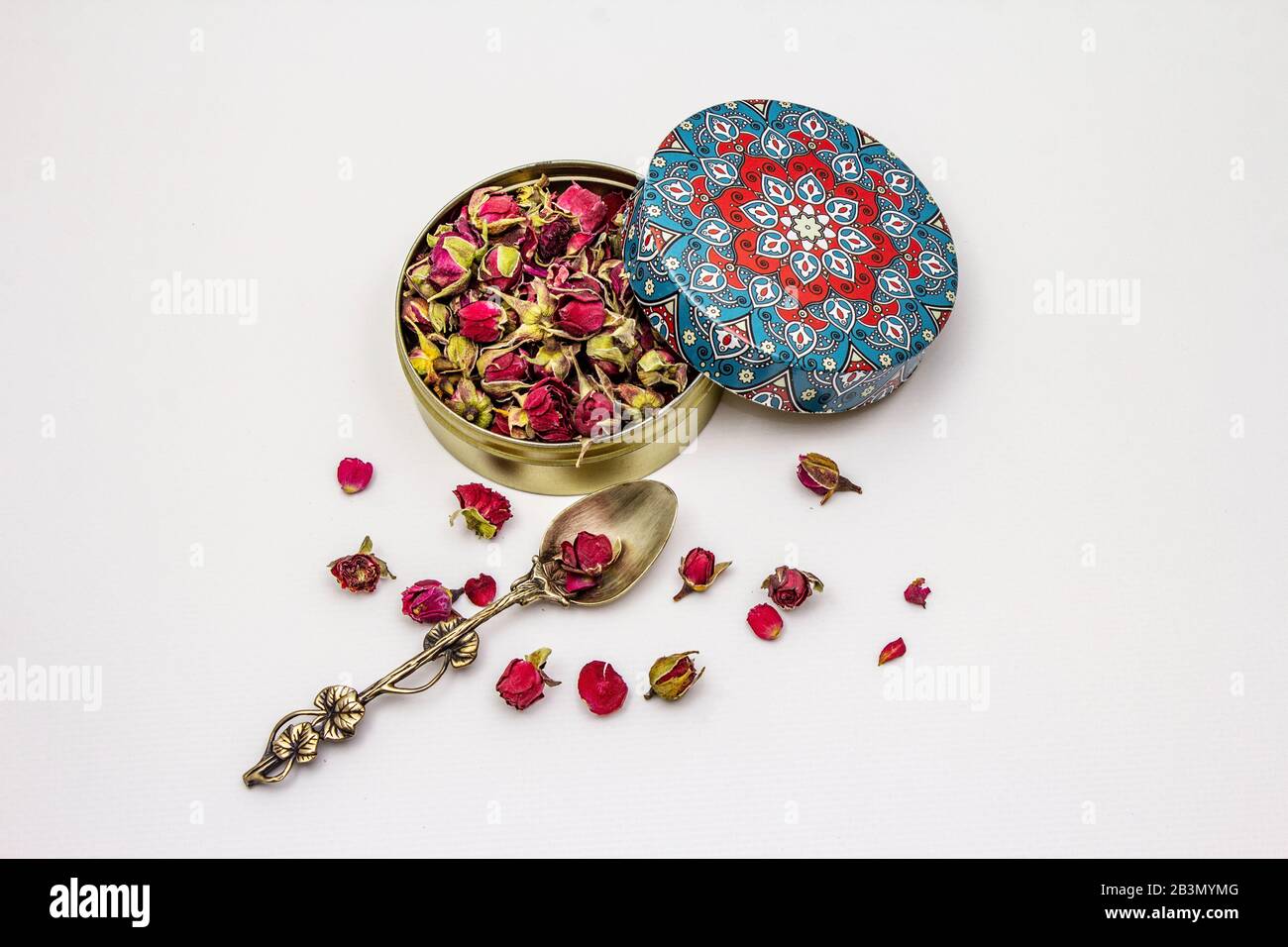 Traditional Turkish rose bud tea isolated on white background. Tin box ...