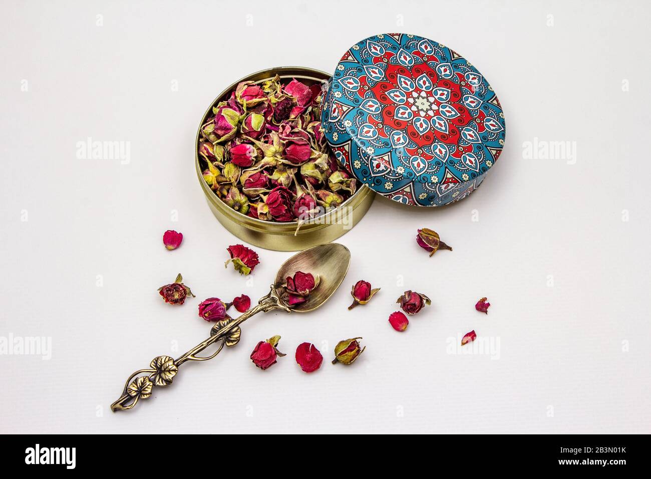Traditional Turkish rose bud tea isolated on white background. Tin box ...