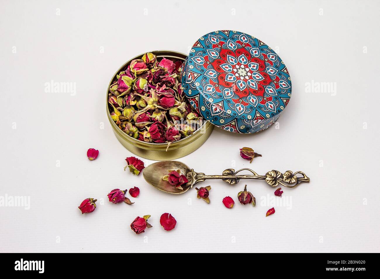 Traditional Turkish rose bud tea isolated on white background. Tin box ...