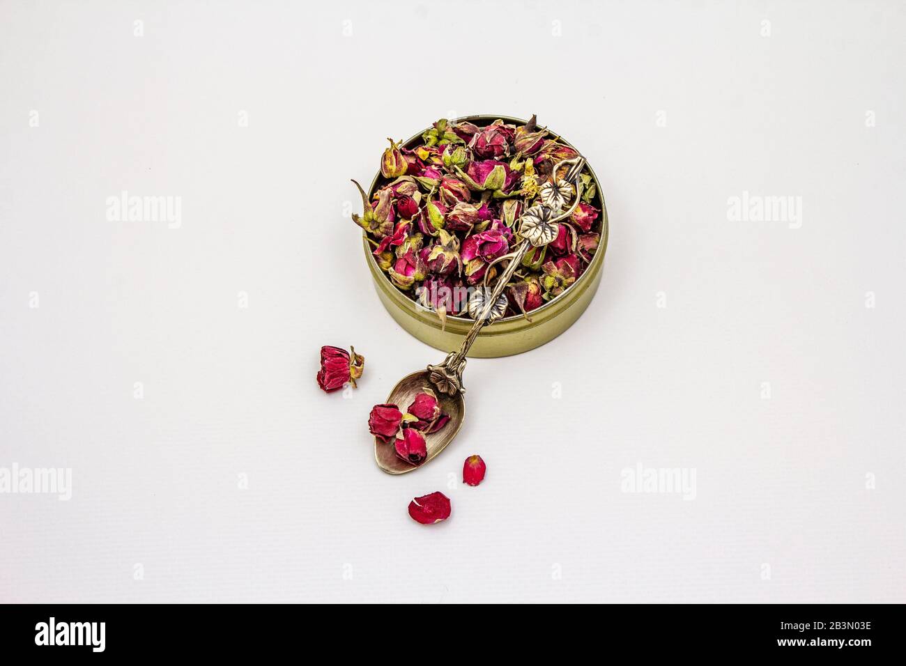 Traditional Turkish rose bud tea isolated on white background. Tin box ...