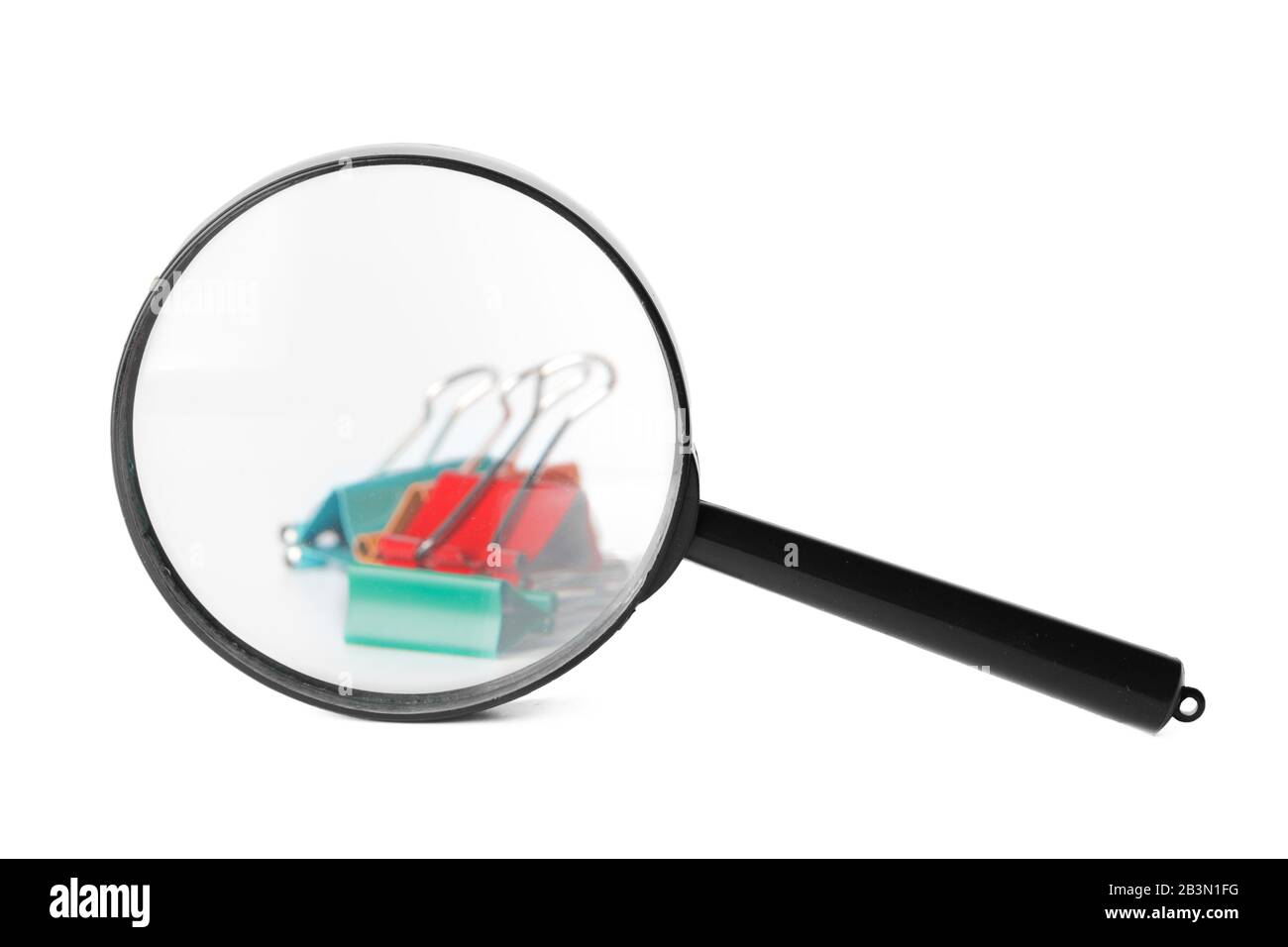 Magnifying glass looking at closeup of push pin tacks Stock Photo - Alamy