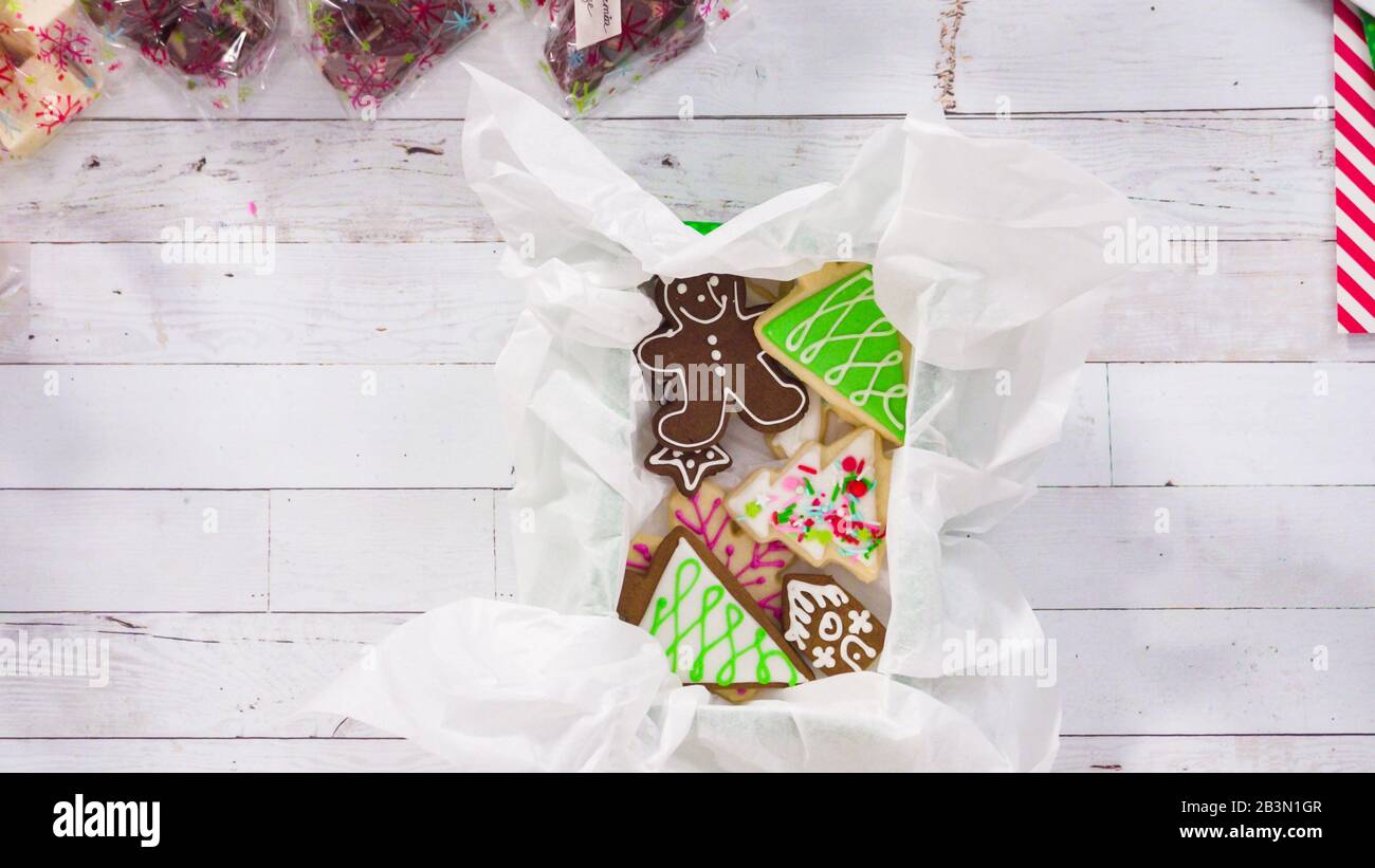 Flat lay. Step by step. Packaging homemade fudge and cookies into a ...