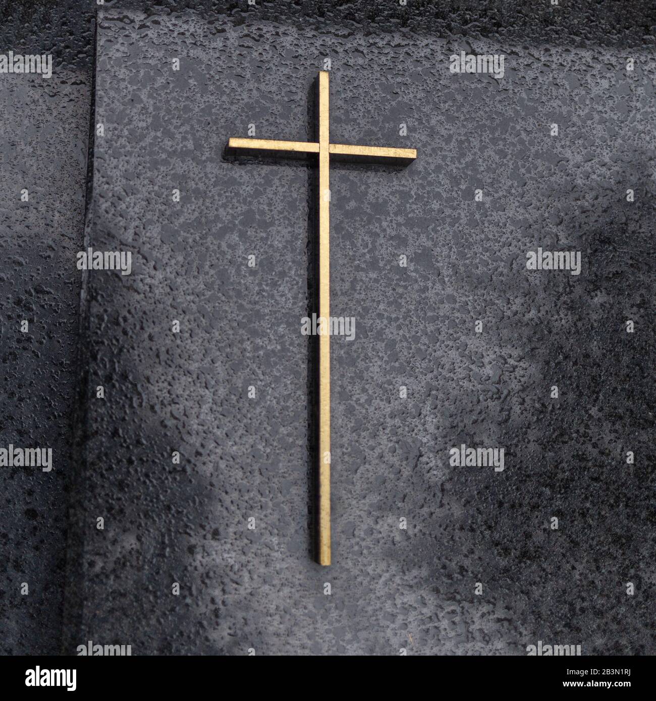 old gold crossgrave cemetery on black marble texture, unmarked grave on ...