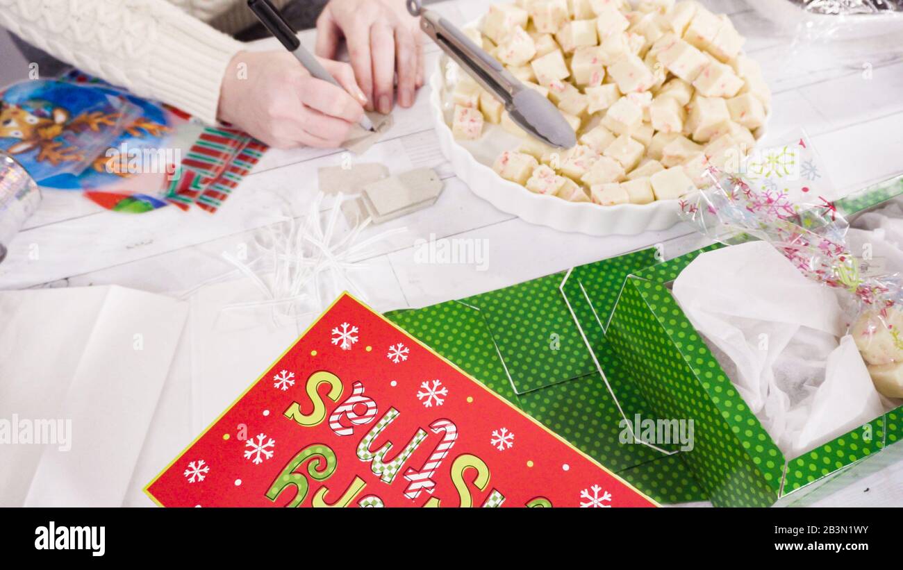 Step by step. Packaging homemade fudge and cookies into a Christmas ...