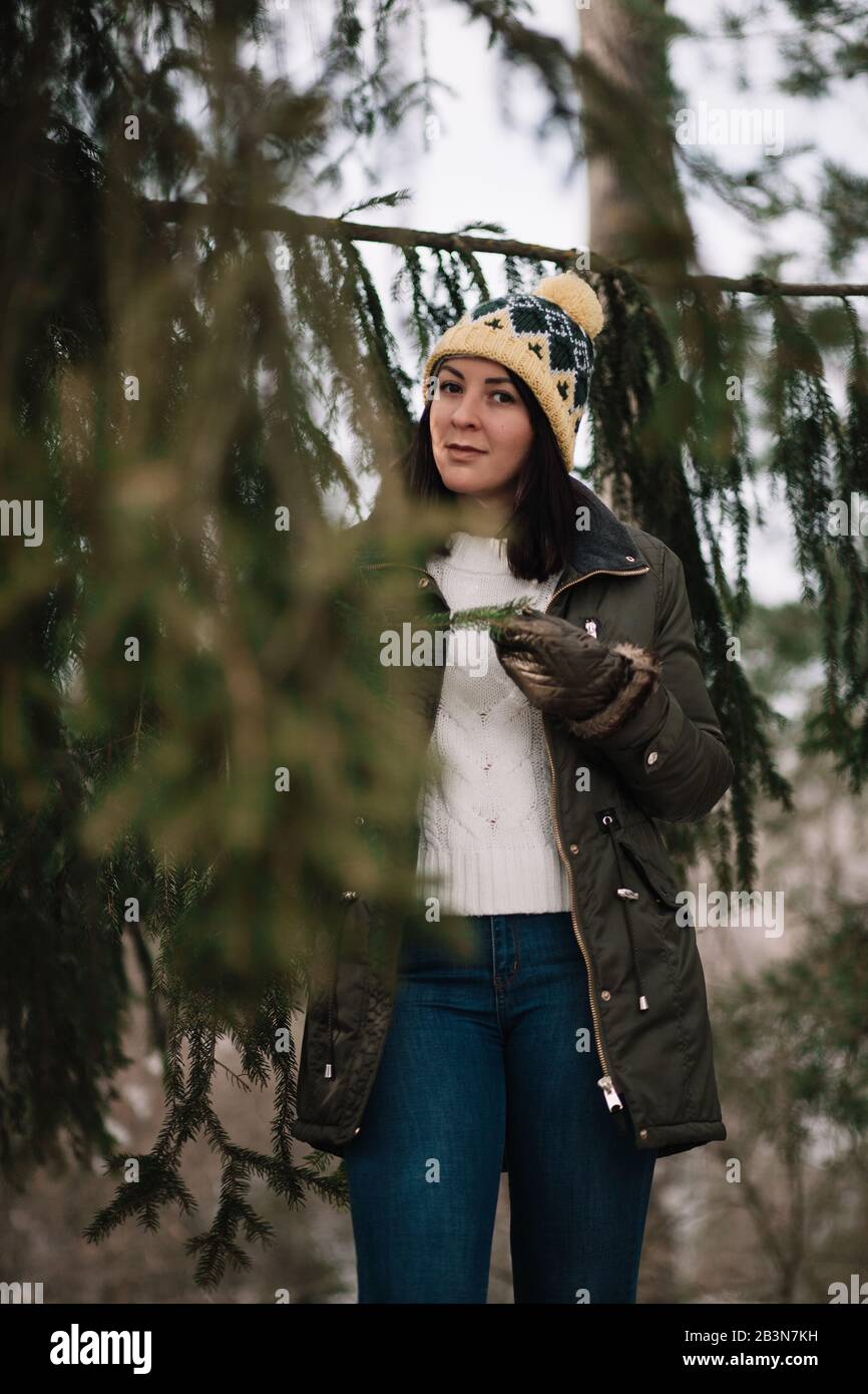 Portrait of a girl in the forest. Pretty woman with unbuttoned jacket ...