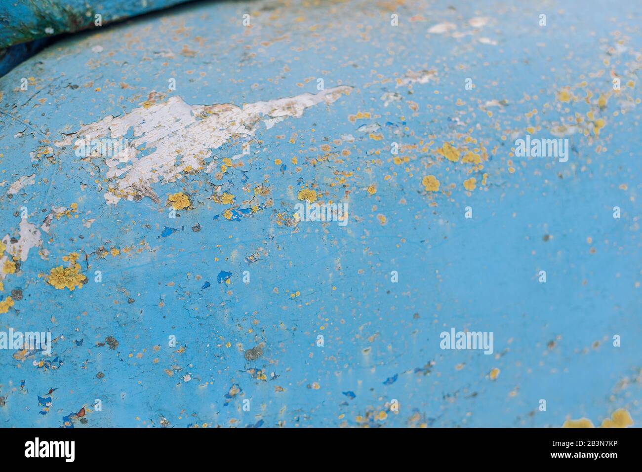 Cracked blue paint with yellow inserts and scratches Stock Photo - Alamy