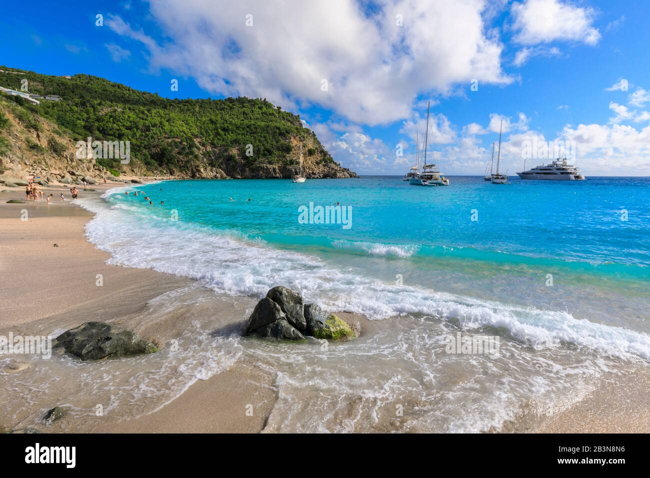 Shell Beach, yachts anchored in turquoise bay, people in sea, Gustavia ...