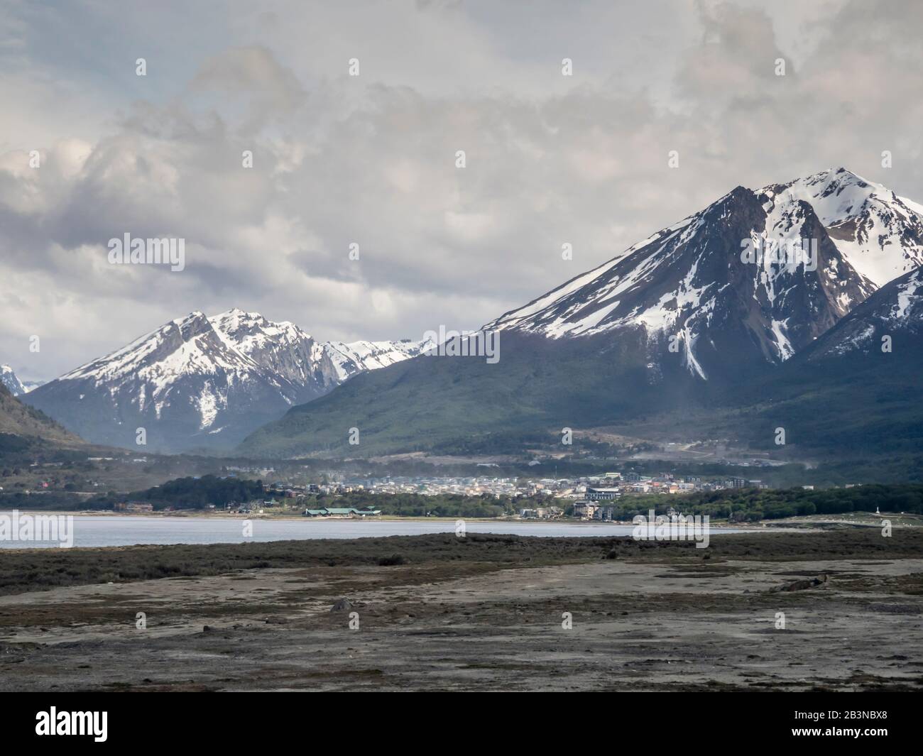 An aerial view of the snow-capped Andes Mountains surrounding the town ...