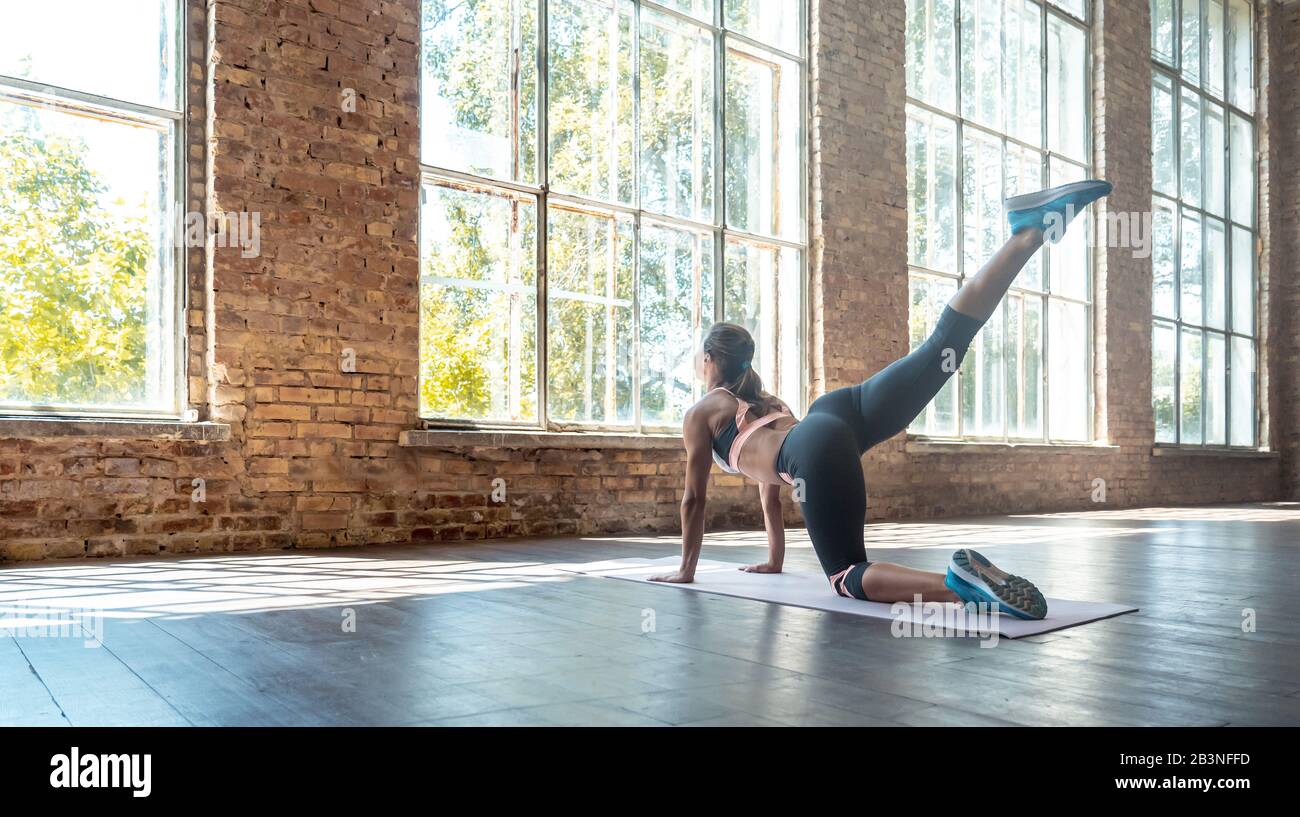 young sporty woman practice hatha yoga one legged table pose healthy ...