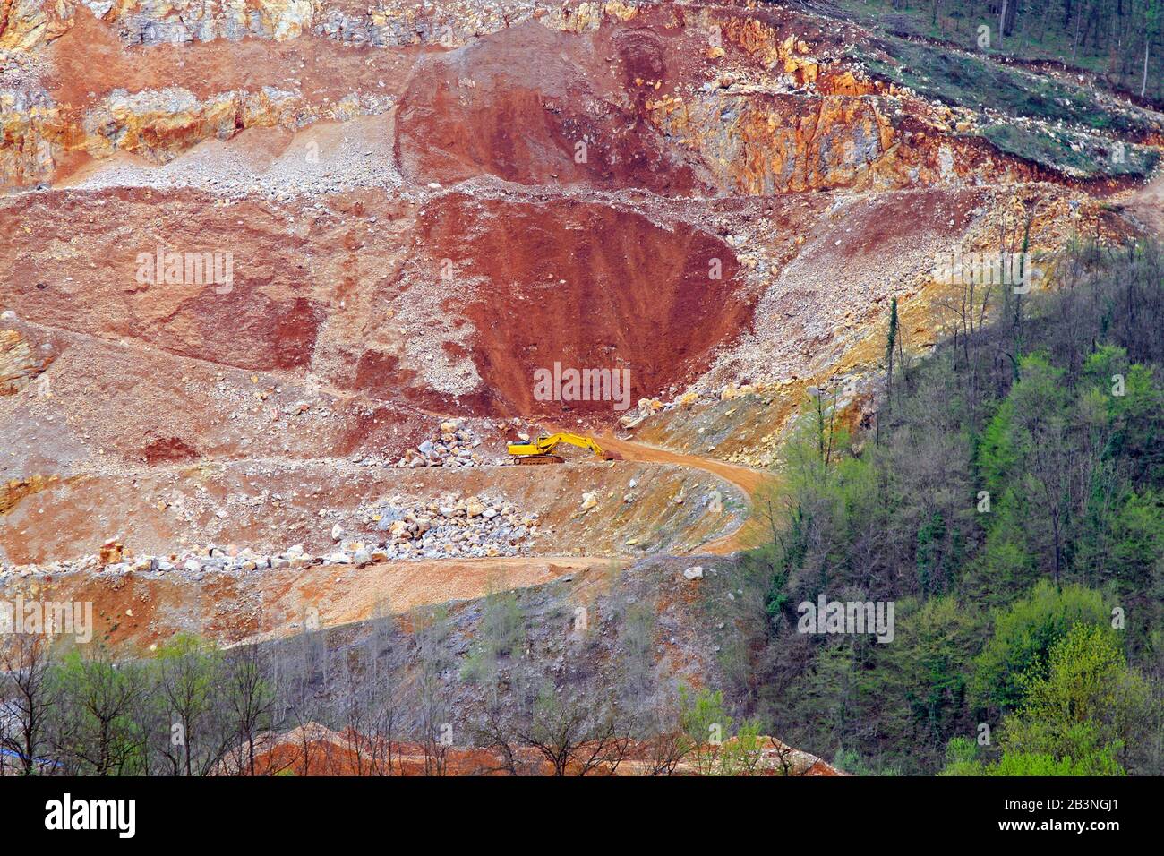 Quarry in mountain digging for raw material Stock Photo - Alamy