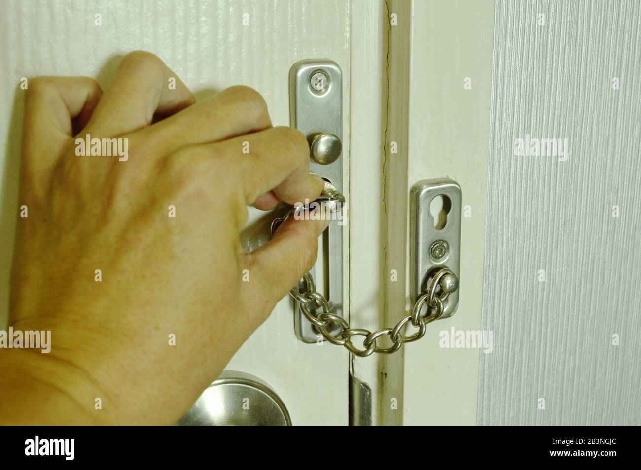 hand locked hoop chain for safety in home Stock Photo - Alamy