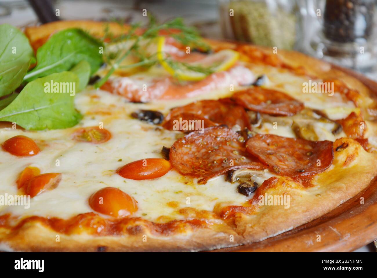 pizza topping salami and tomato on clay plate Stock Photo - Alamy