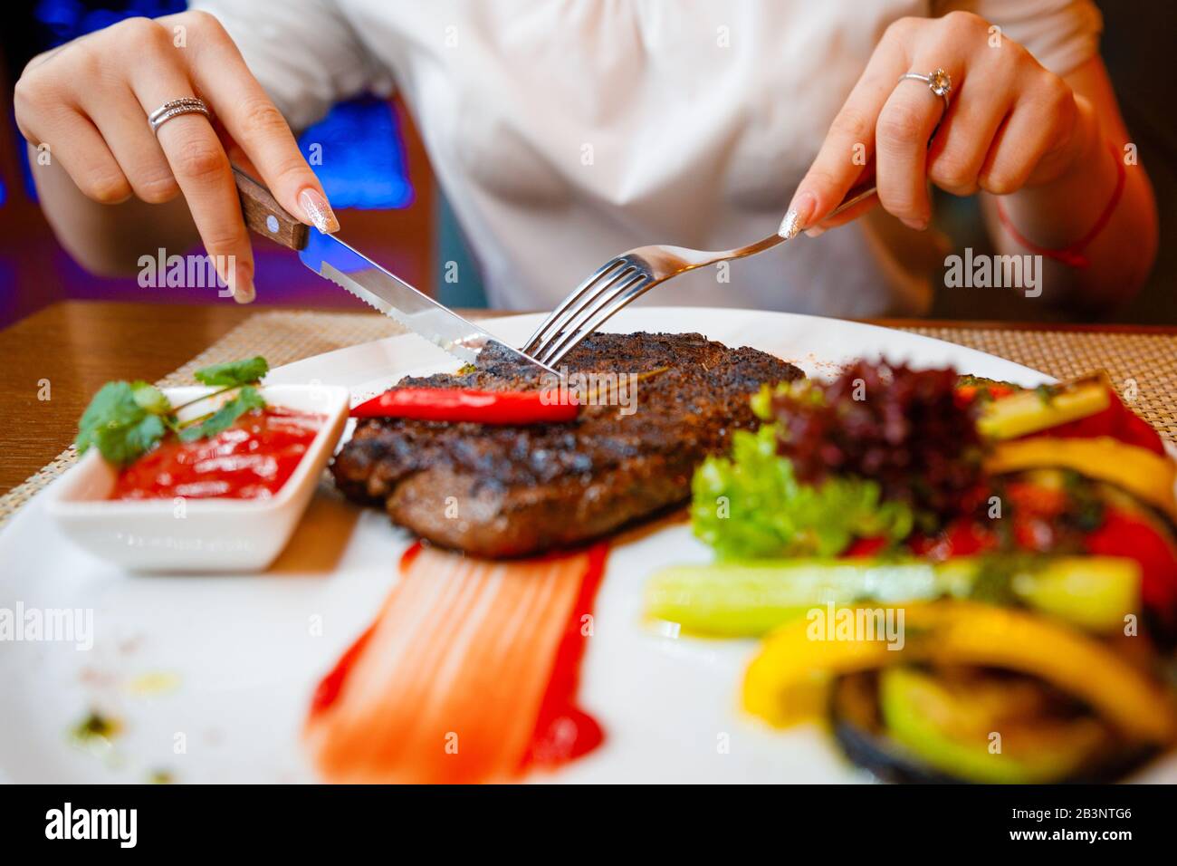 Medium-sized steak with vegetables in a cafe Stock Photo - Alamy