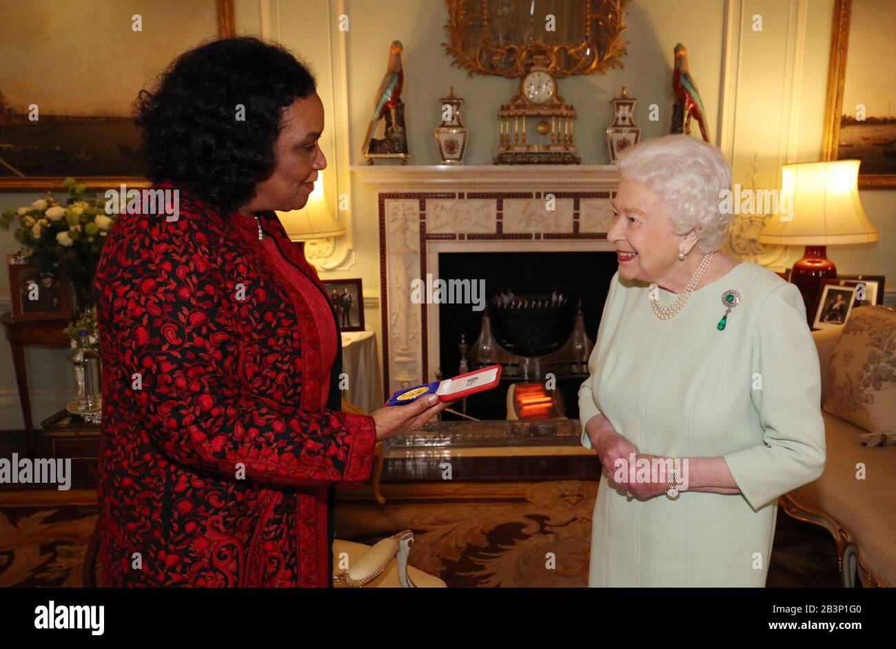 Queen Elizabeth II (right) presents Lorna Goodison with the Queen's ...