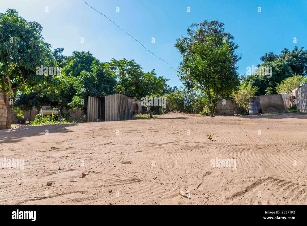 Sandy road of African neighborhood in Zimpeto, Maputo, Mozambique Stock ...