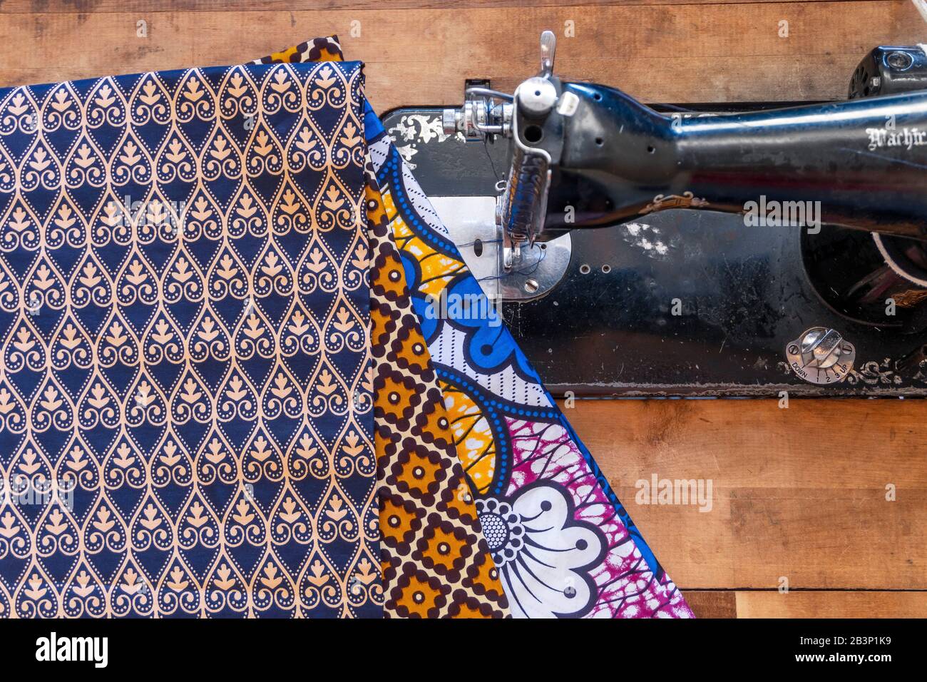 Sewing machine and African fabrics in seamstress workshop, Mozambique ...