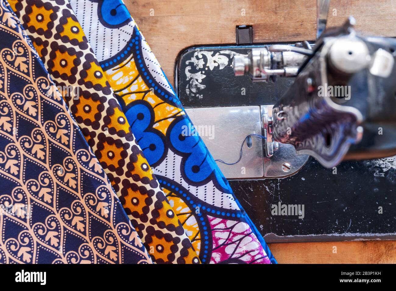 Sewing machine and African fabrics in seamstress workshop, Mozambique ...