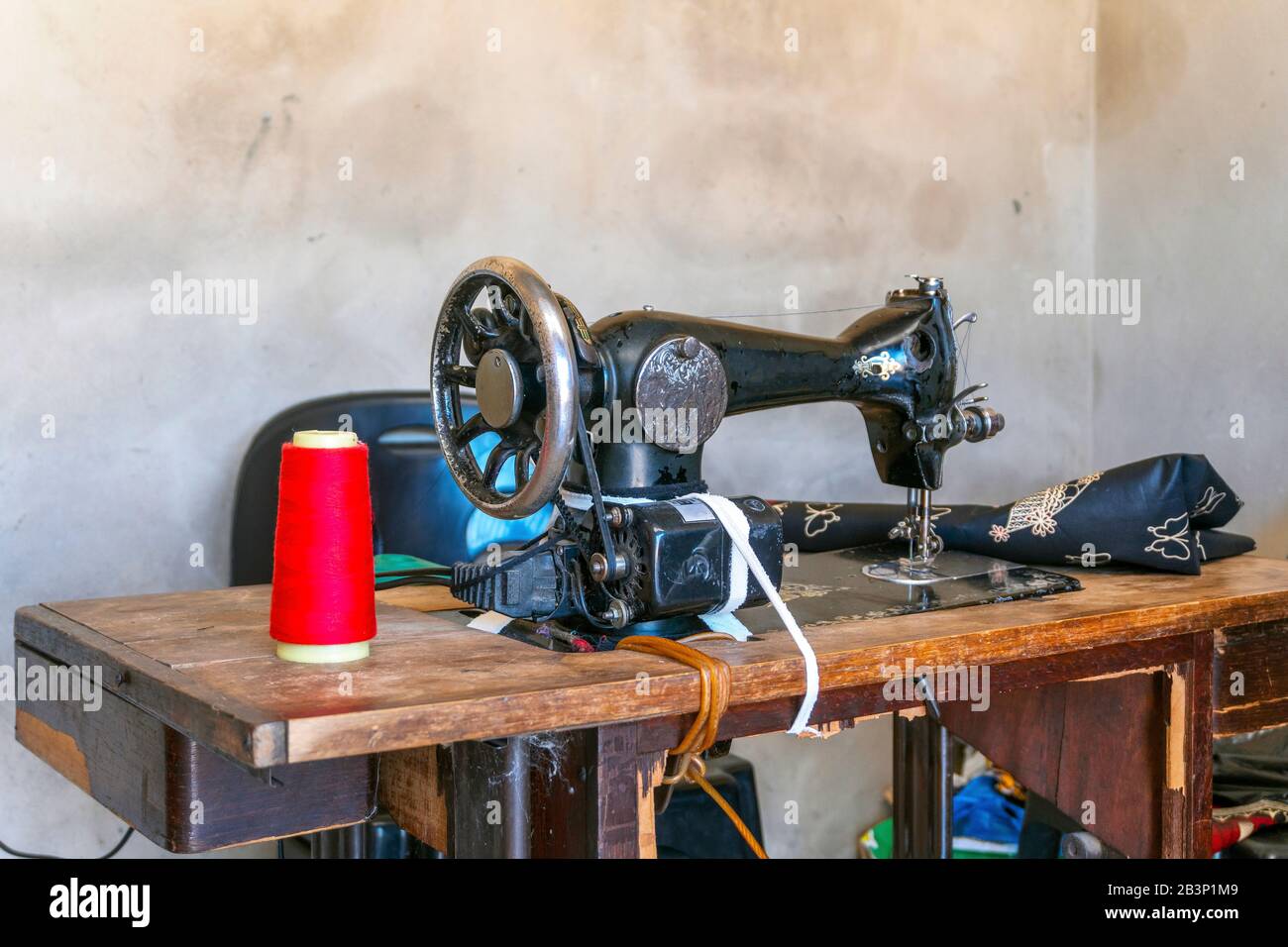 Sewing machine and African fabrics in seamstress workshop, Mozambique ...