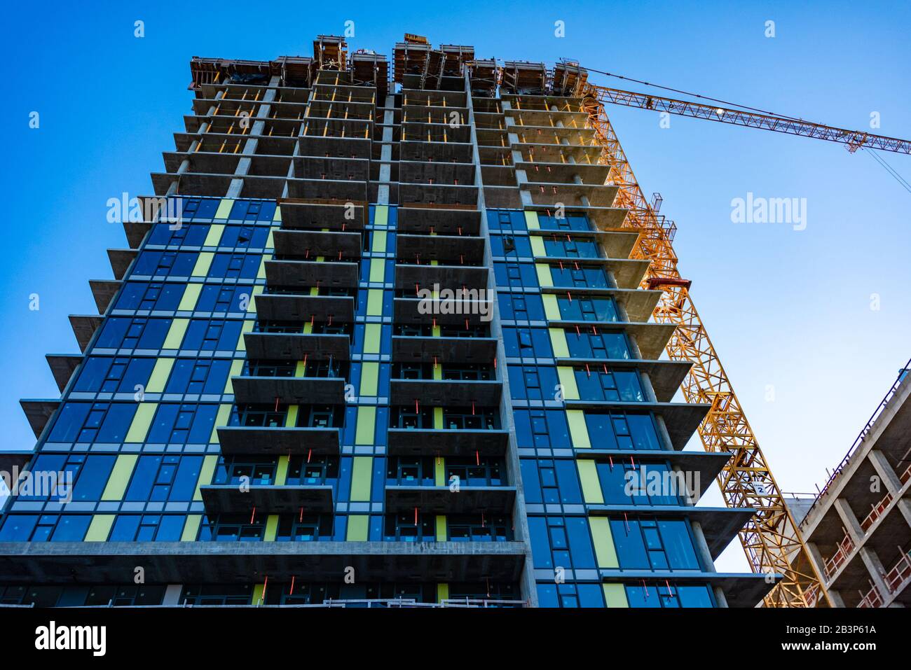 Monolite concrete building under constraction on blue sky background ...