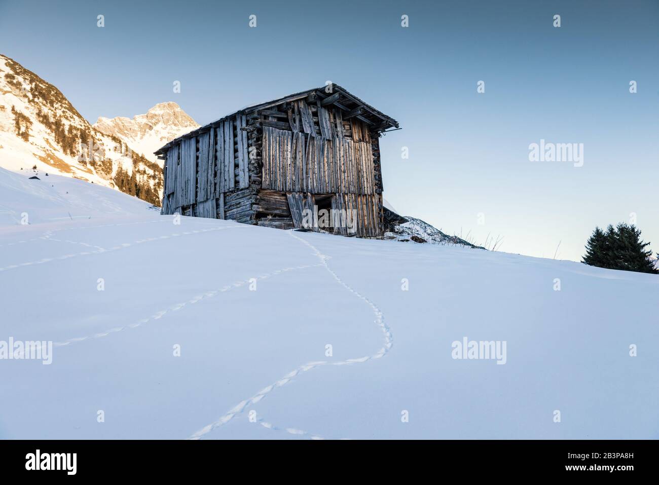 An old wooden barn in the snowy Alps in Austria Stock Photo - Alamy