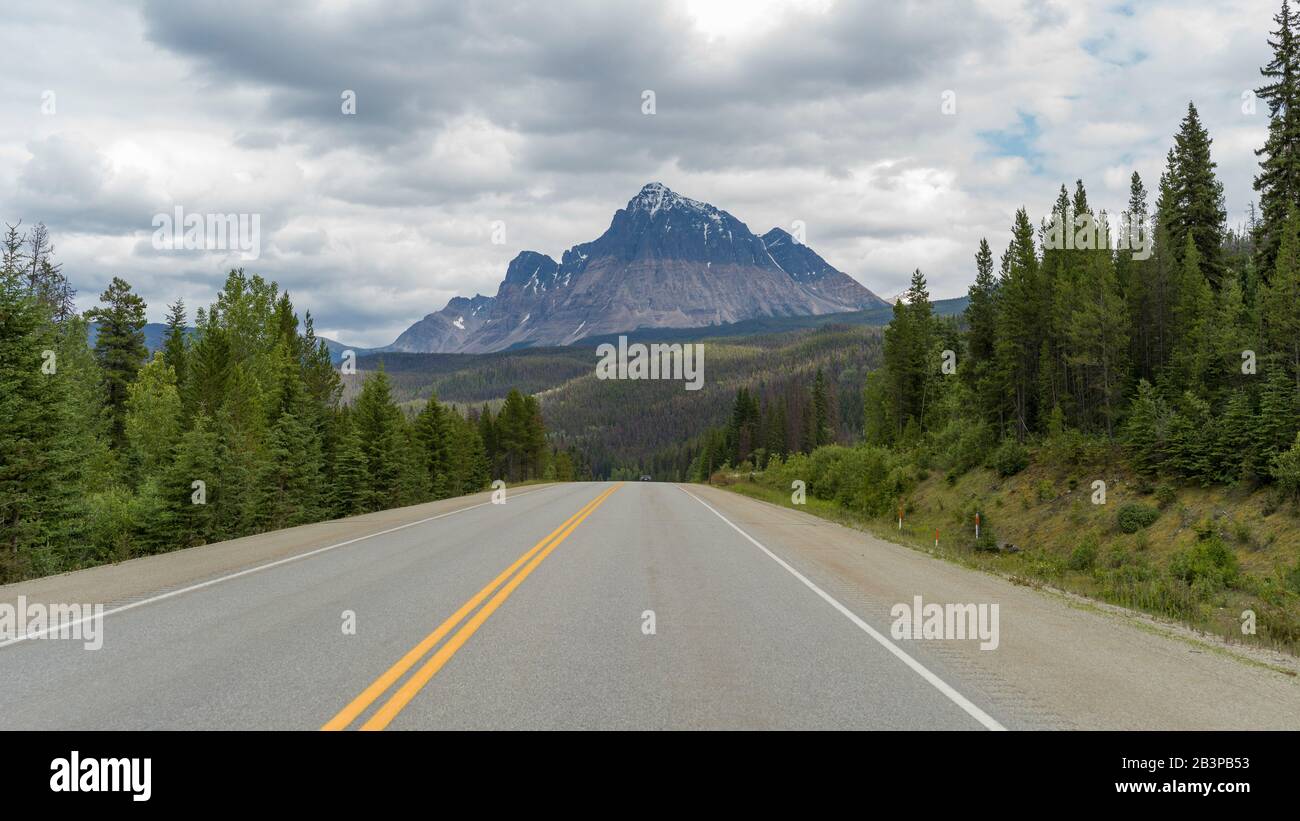 Highway with mountain range in the background, Yellowhead Highway ...