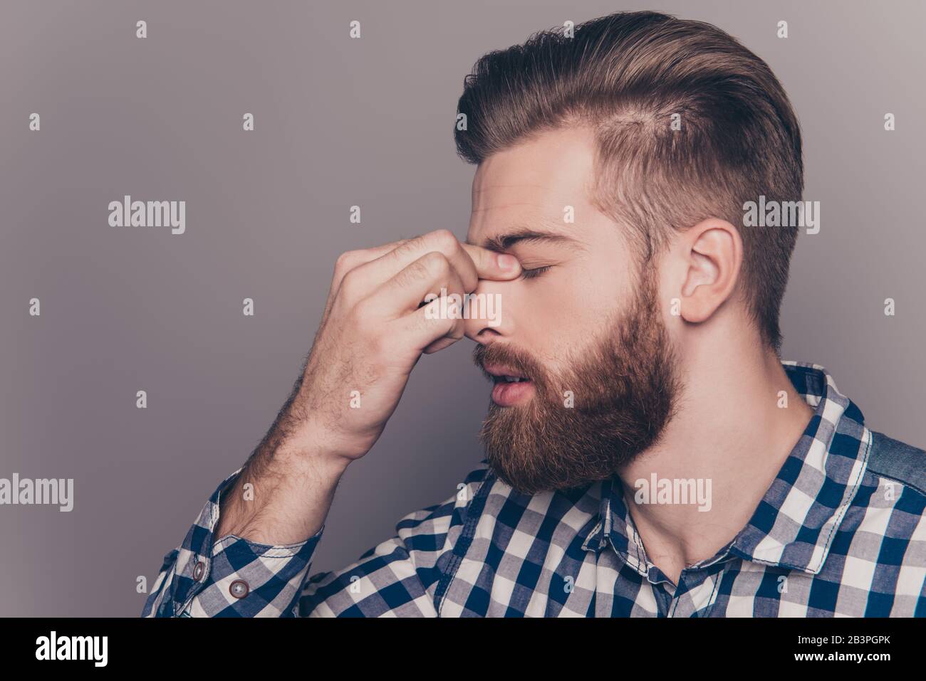 side-view portrait of tired sick handsome young man with strong ...