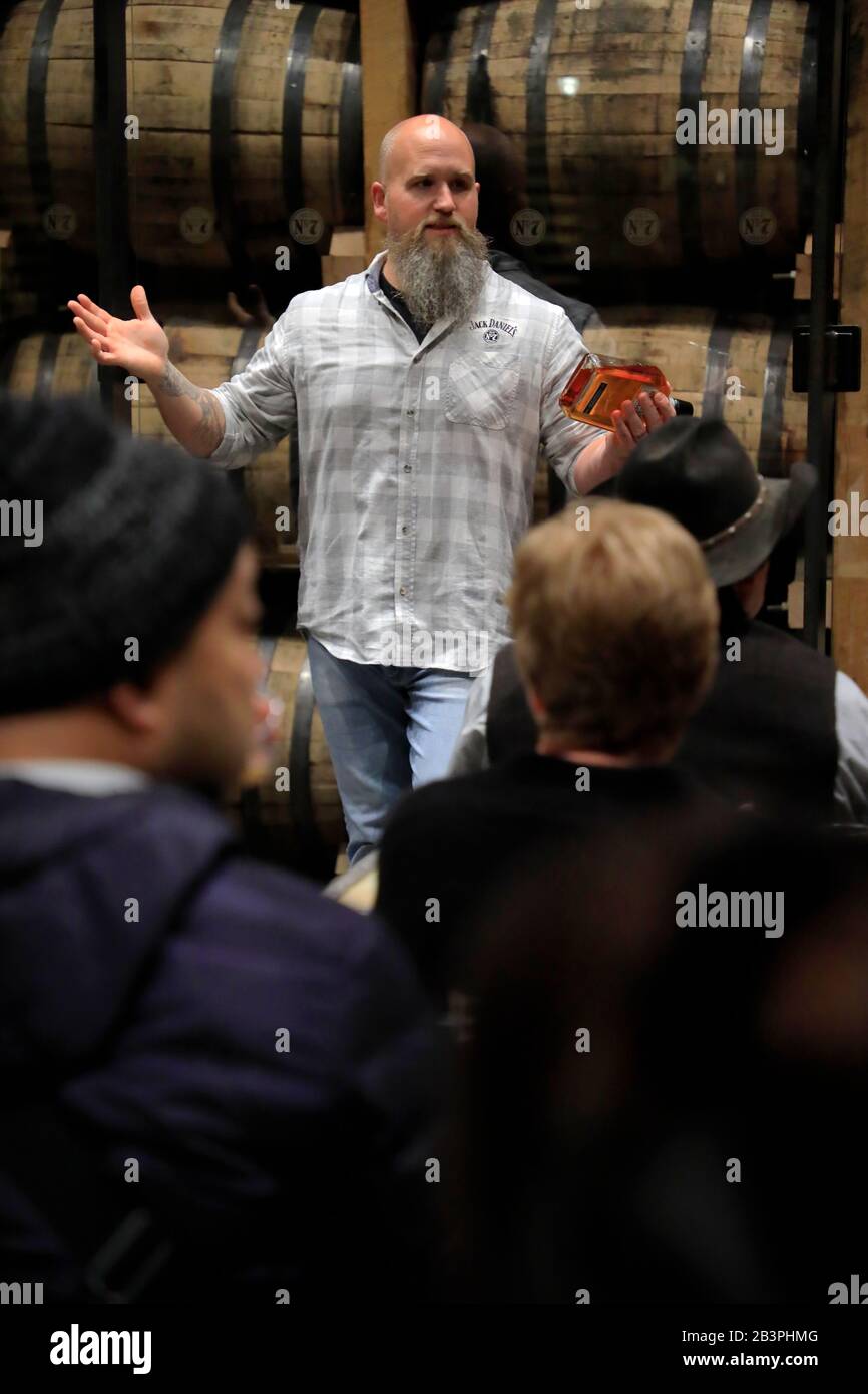 Tour guide introduce Jack Daniel's whiskey in a Whiskey tasting session ...
