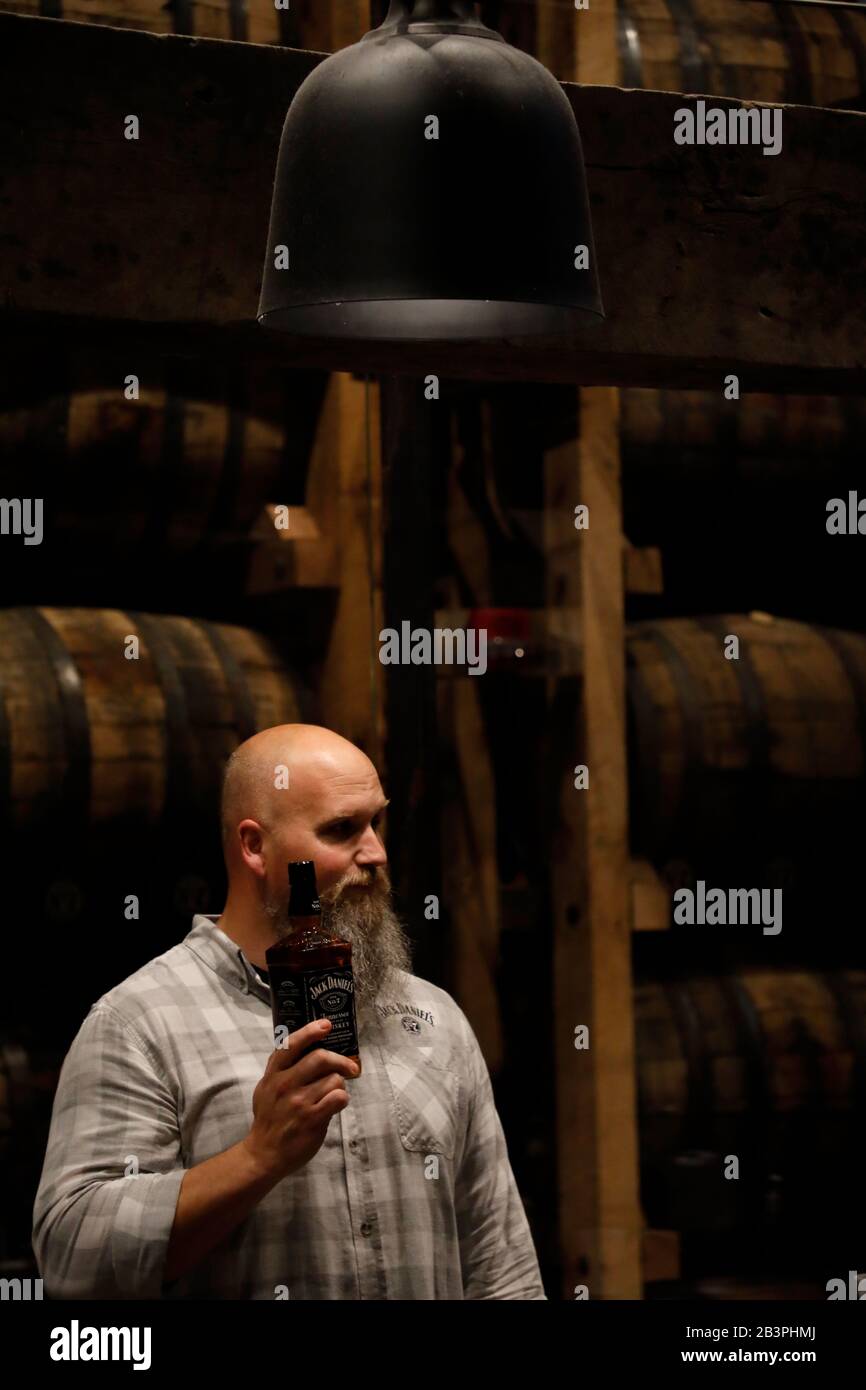 Tour guide introduce Jack Daniel's whiskey in a Whiskey tasting session ...