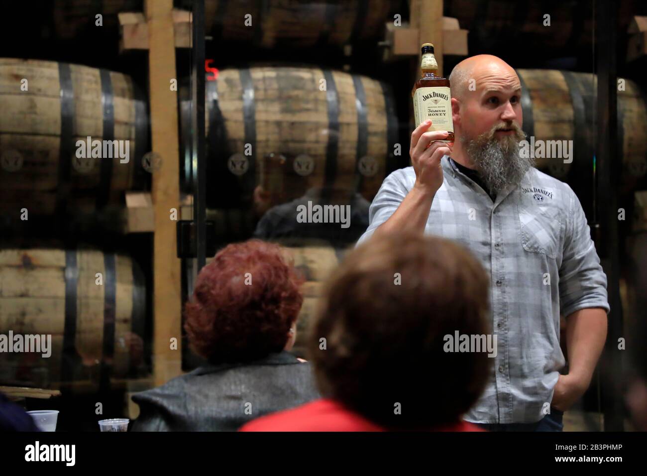 Tour guide introduce Jack Daniel's whiskey in a Whiskey tasting session ...