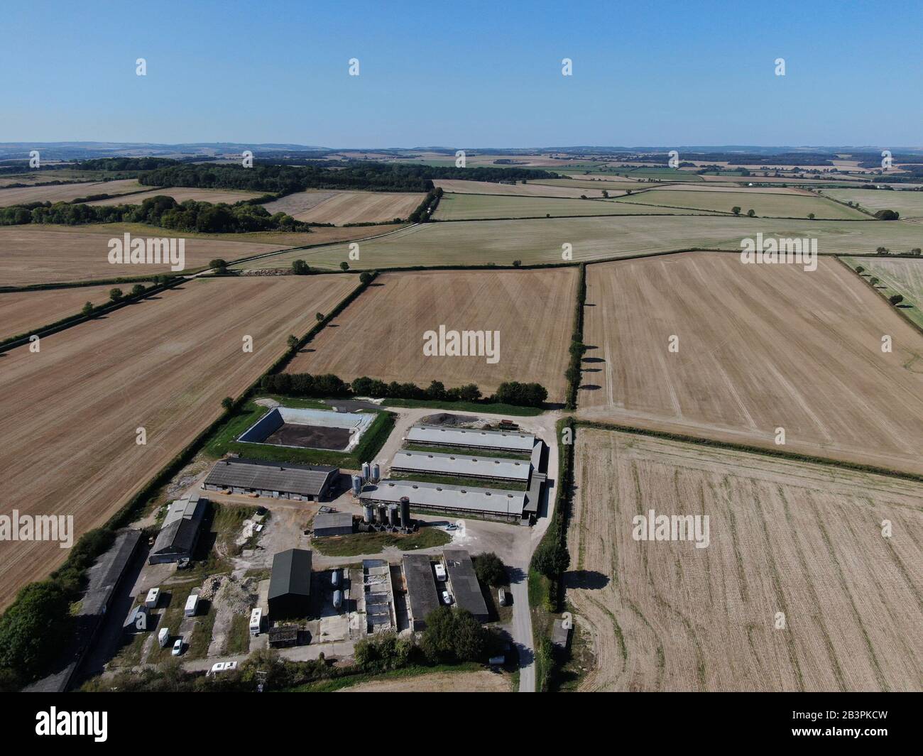 aerial view of modern farm yard showing neat buildings and surrounded ...
