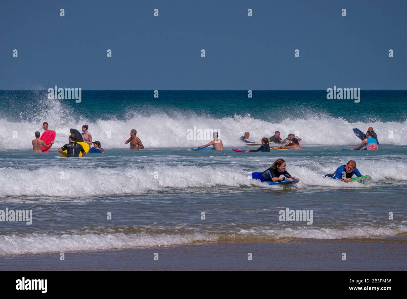 Surfers and Bodyboarders, Perran beach, Perranporth, north Cornwall, UK ...