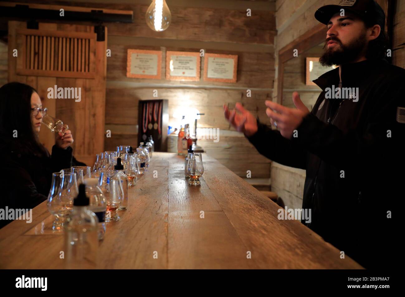 Guide introducing whiskey during a tasting session inside the tasting ...