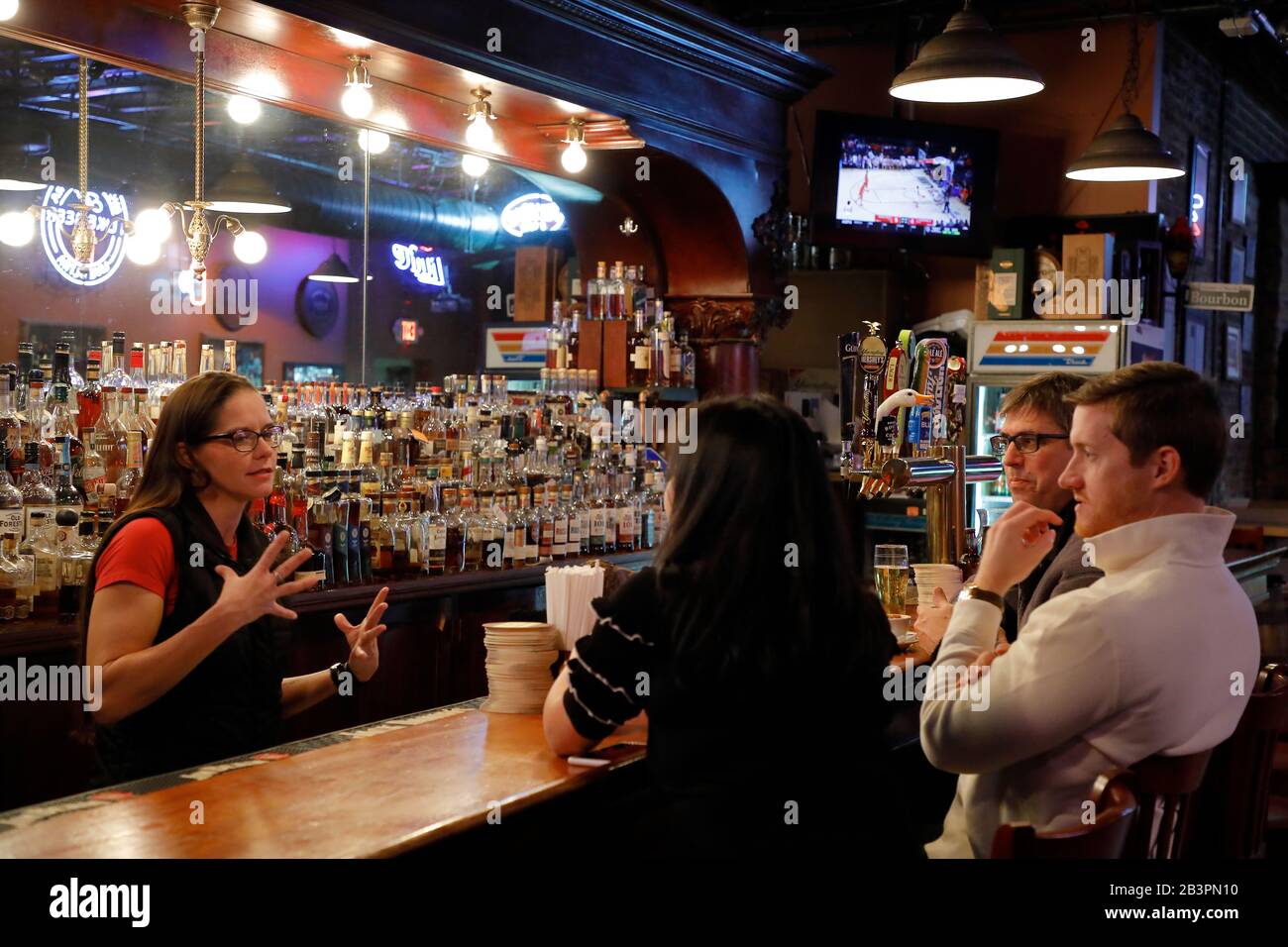 The bourbon bar inside of Old Talbott Tavern with bartender and ...