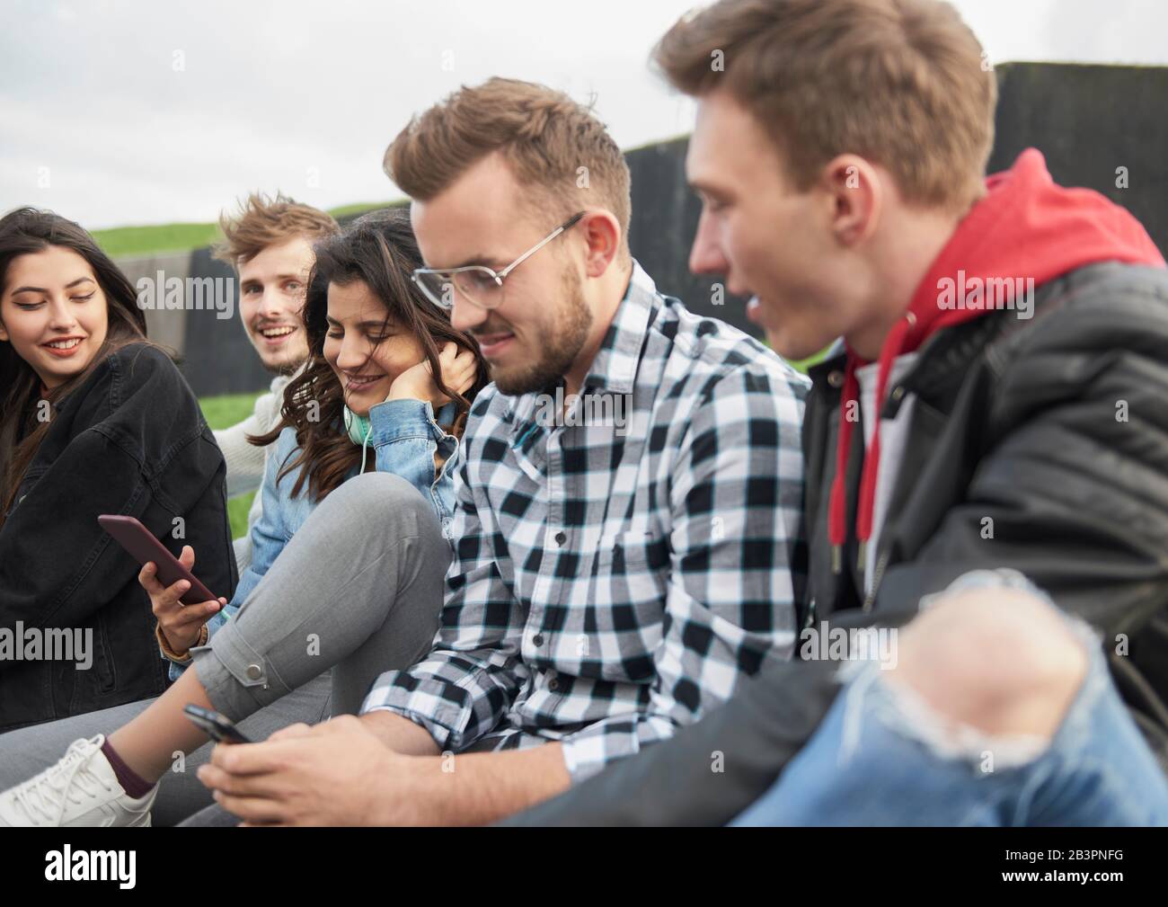 Group of people checking mobile phone hi-res stock photography and images - Alamy