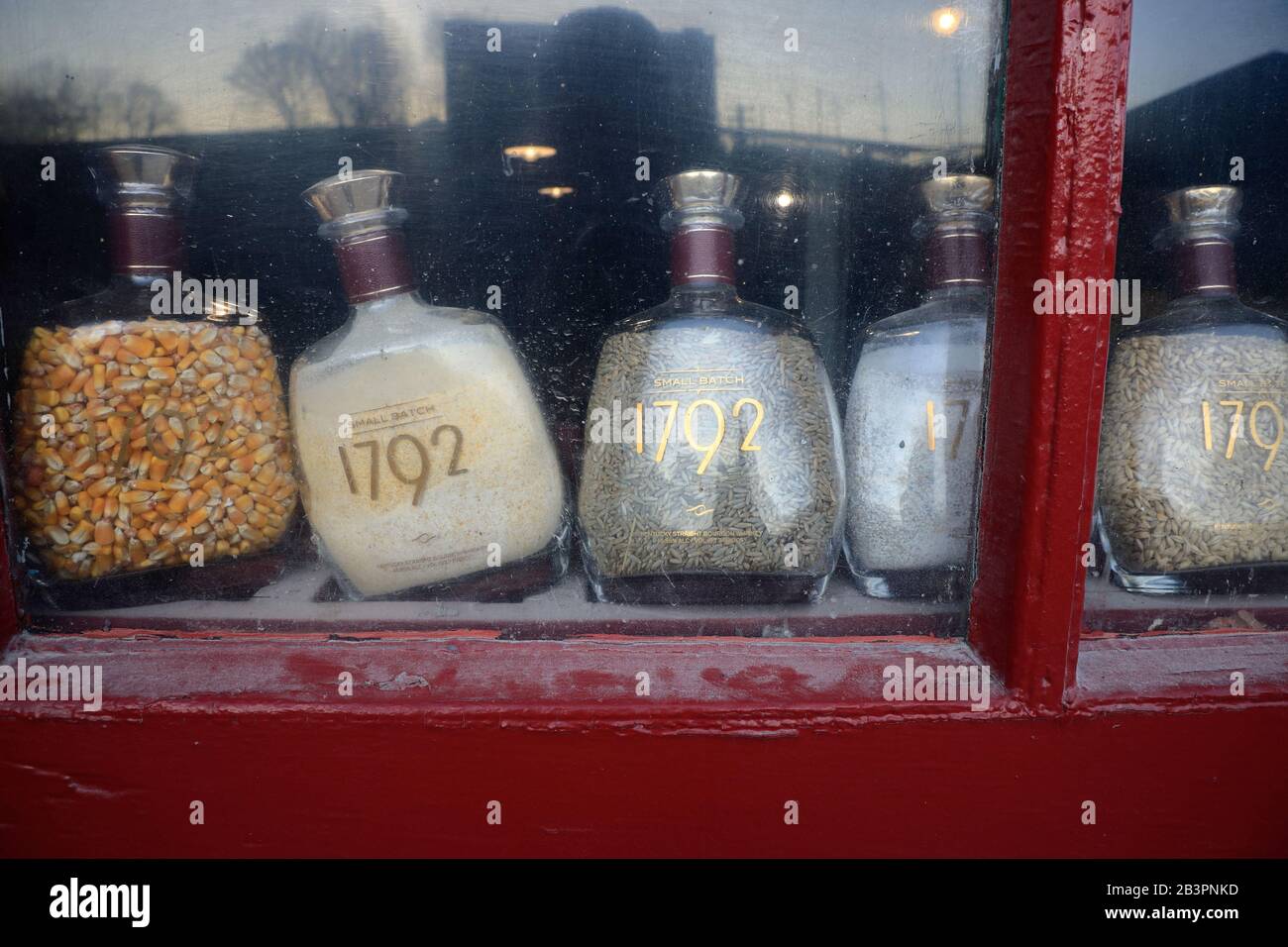 Grain samples for making Bourbon whiskey display in empty whiskey ...