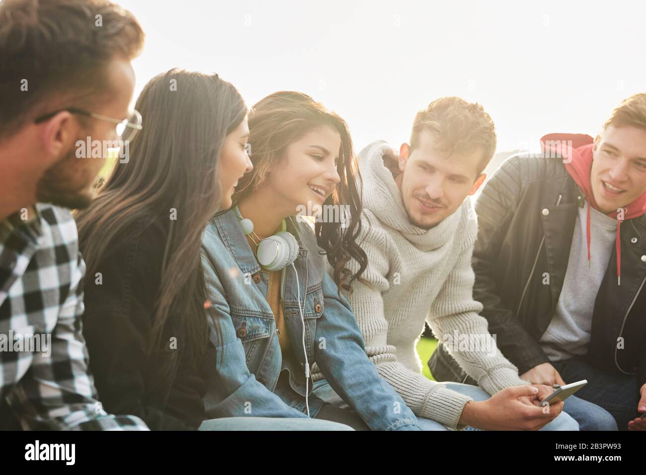 Young people having good time outdoors Stock Photo - Alamy