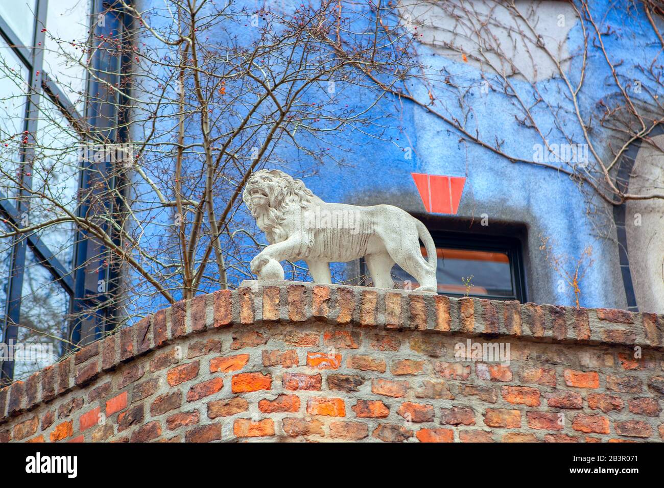 sculpture of the lion on the brick wall Stock Photo - Alamy