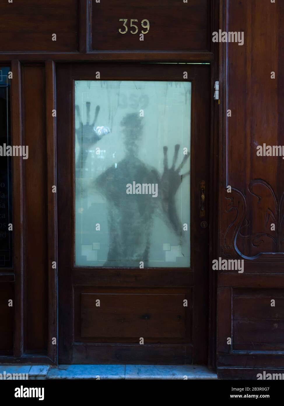 Silhouette behind door hi-res stock photography and images - Alamy