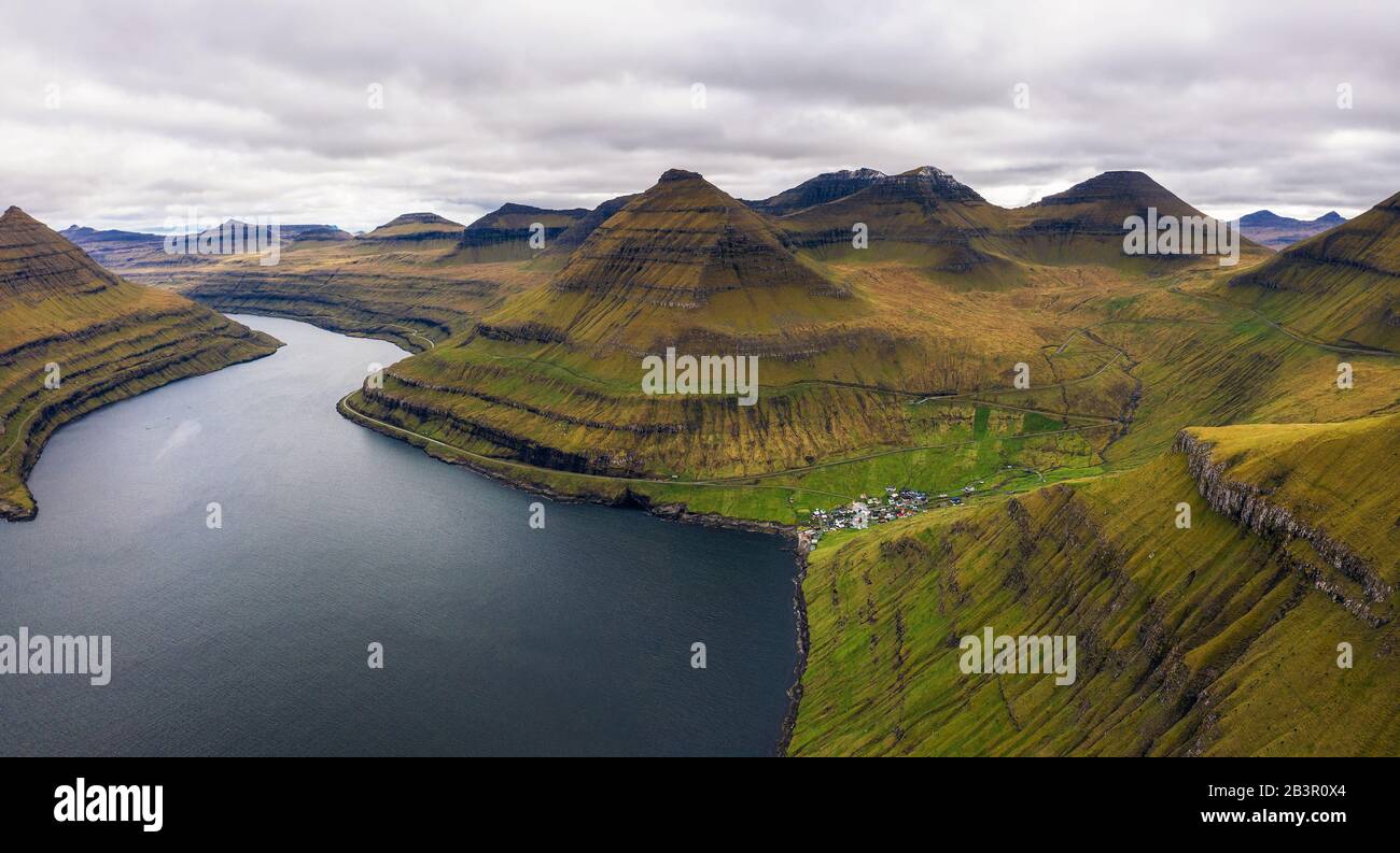 Aerial view of mountains and ocean around village of Funningur on Faroe ...