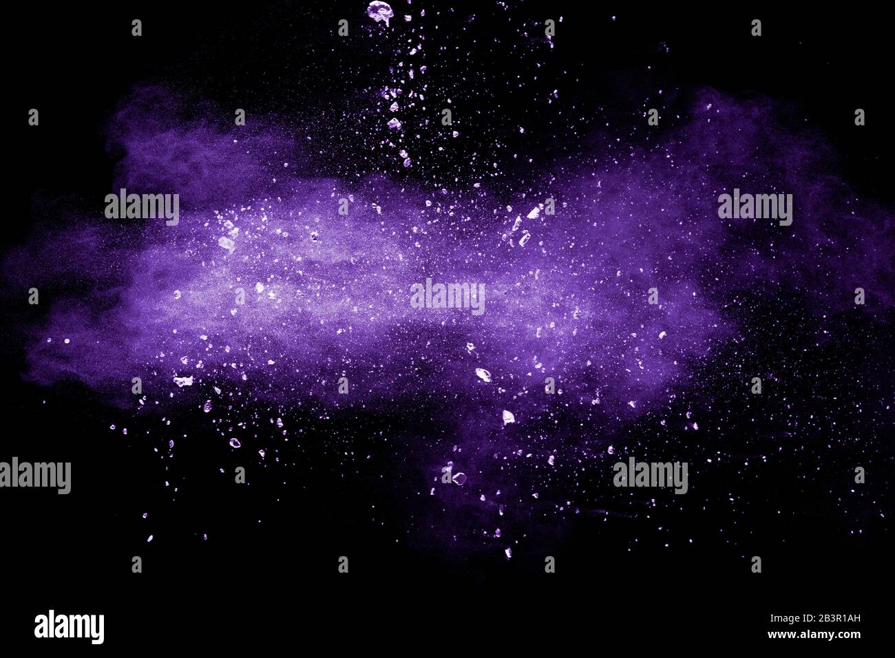 Purple color powder explosion cloud on black background.Purple dust ...