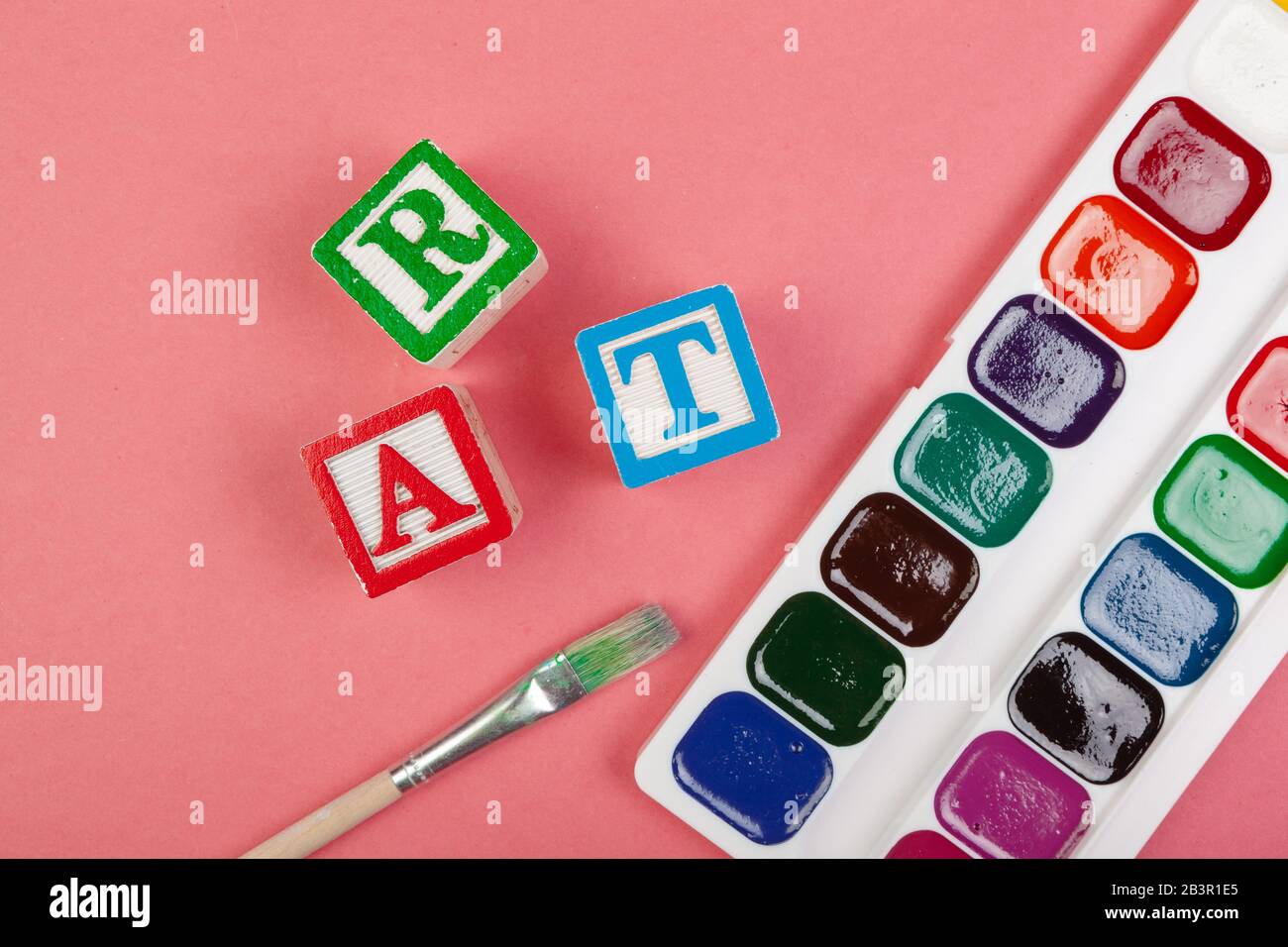 Art concept. School supplies and wooden alphabetical cubes Stock Photo ...