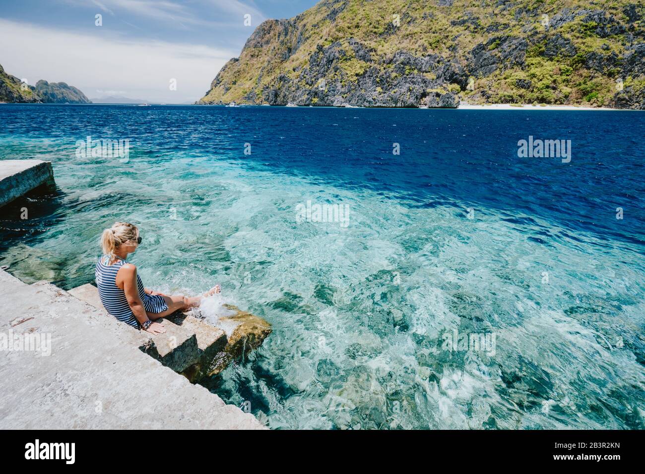 El Nido, Palawan, Philippines. Tourist female on Matinloc dock pier ...