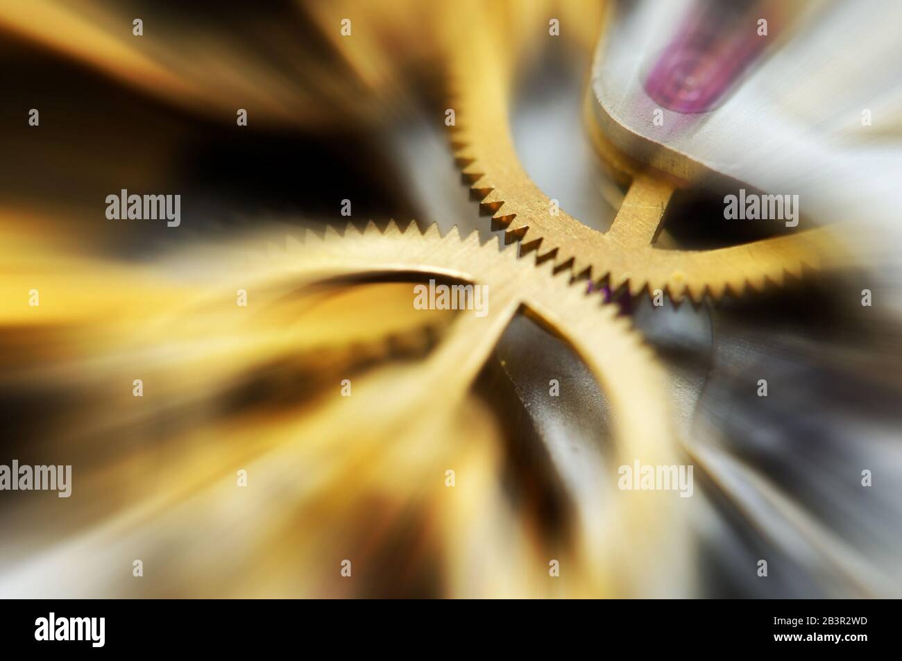 Metal Cogwheels in mechanism , abstract sun beams, Concept Movement is ...