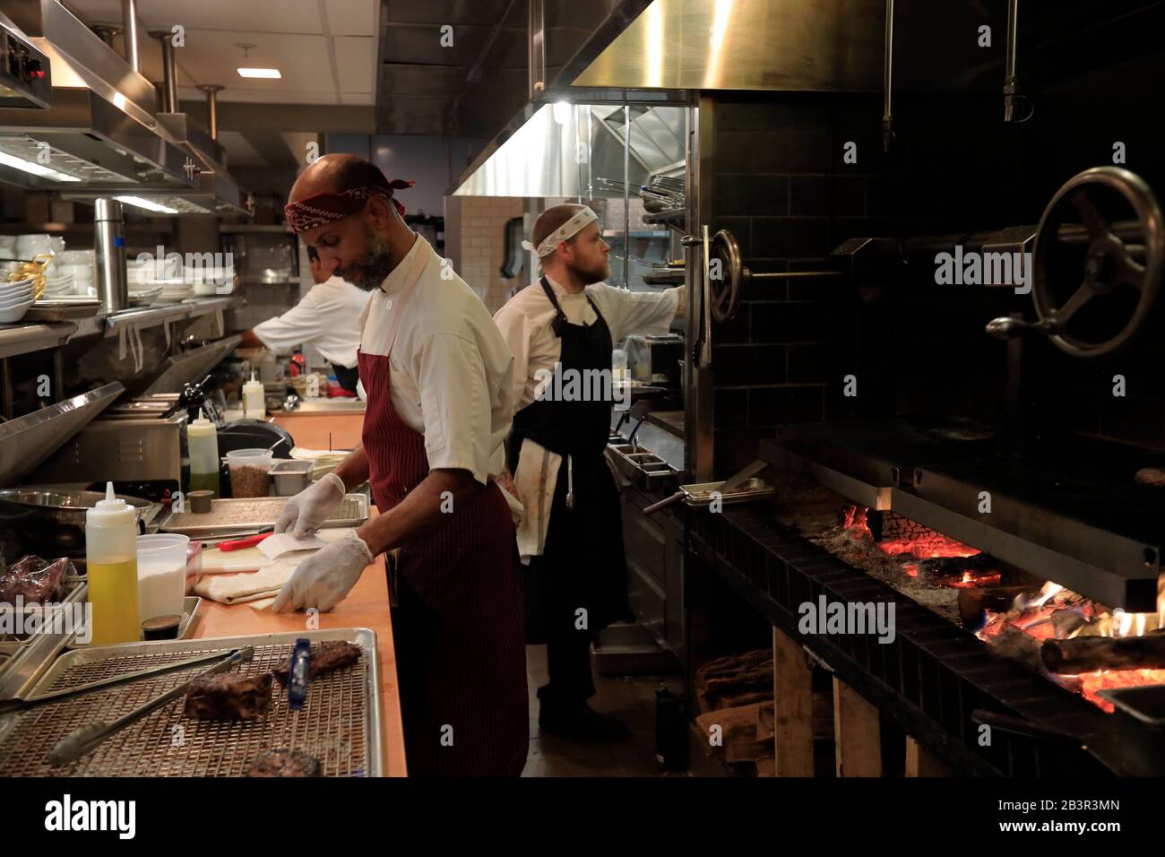 Chef preparing oak wood fired steak in the kitchen of Repeal Oak-Fired ...